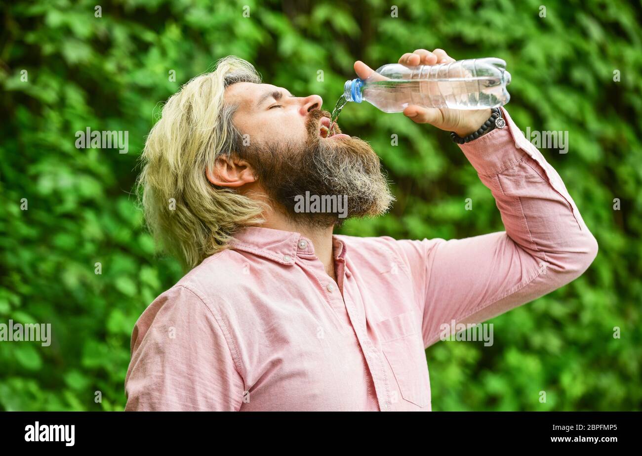 Another sip. Handsome Man Drinking Fresh Water From bottle. Morning ...