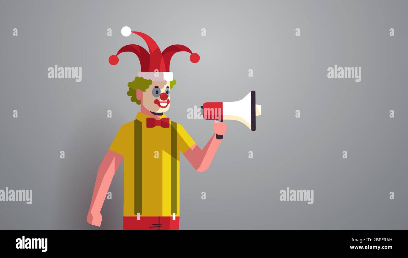 first april fool day man in funny jester hat and clown mask holding ...