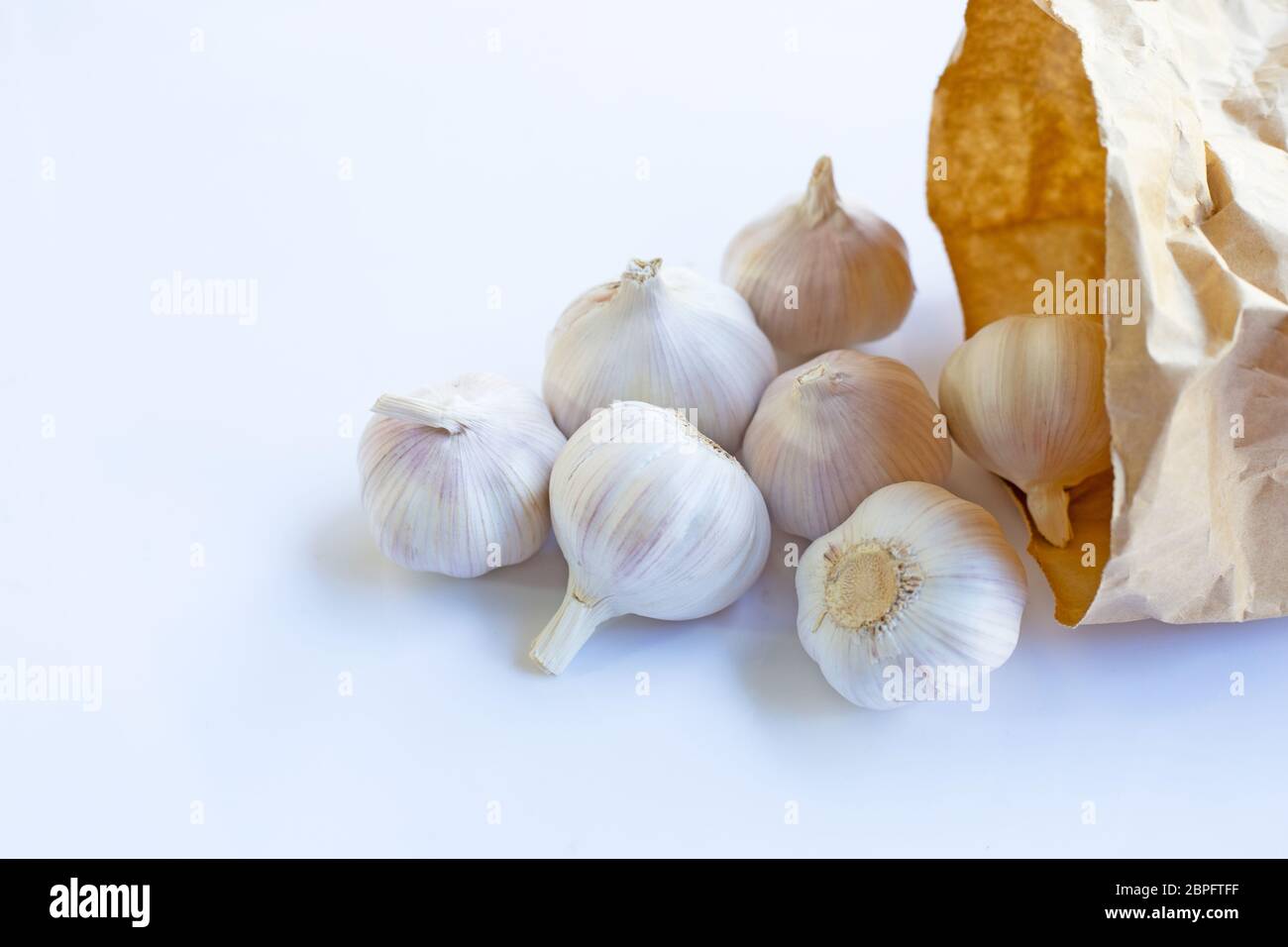 Garlic on white background Stock Photo - Alamy