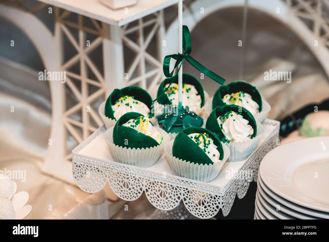 green style wedding candy bar on a white table Stock Photo - Alamy