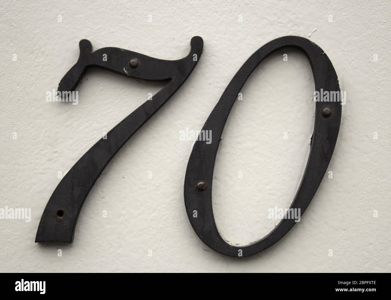 Number seventy in city street, symbol and address Stock Photo - Alamy