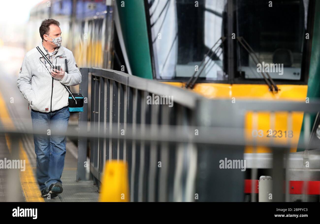 A man on a platform in Heuston station, Dublin, as phase one of Ireland ...