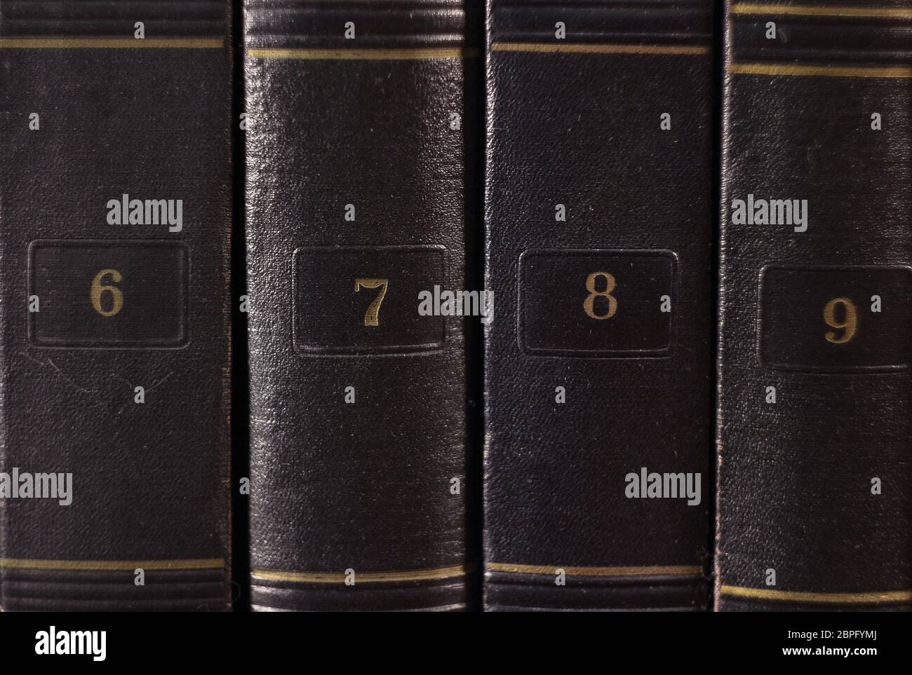 golden numbers on the bindings of old books Stock Photo - Alamy
