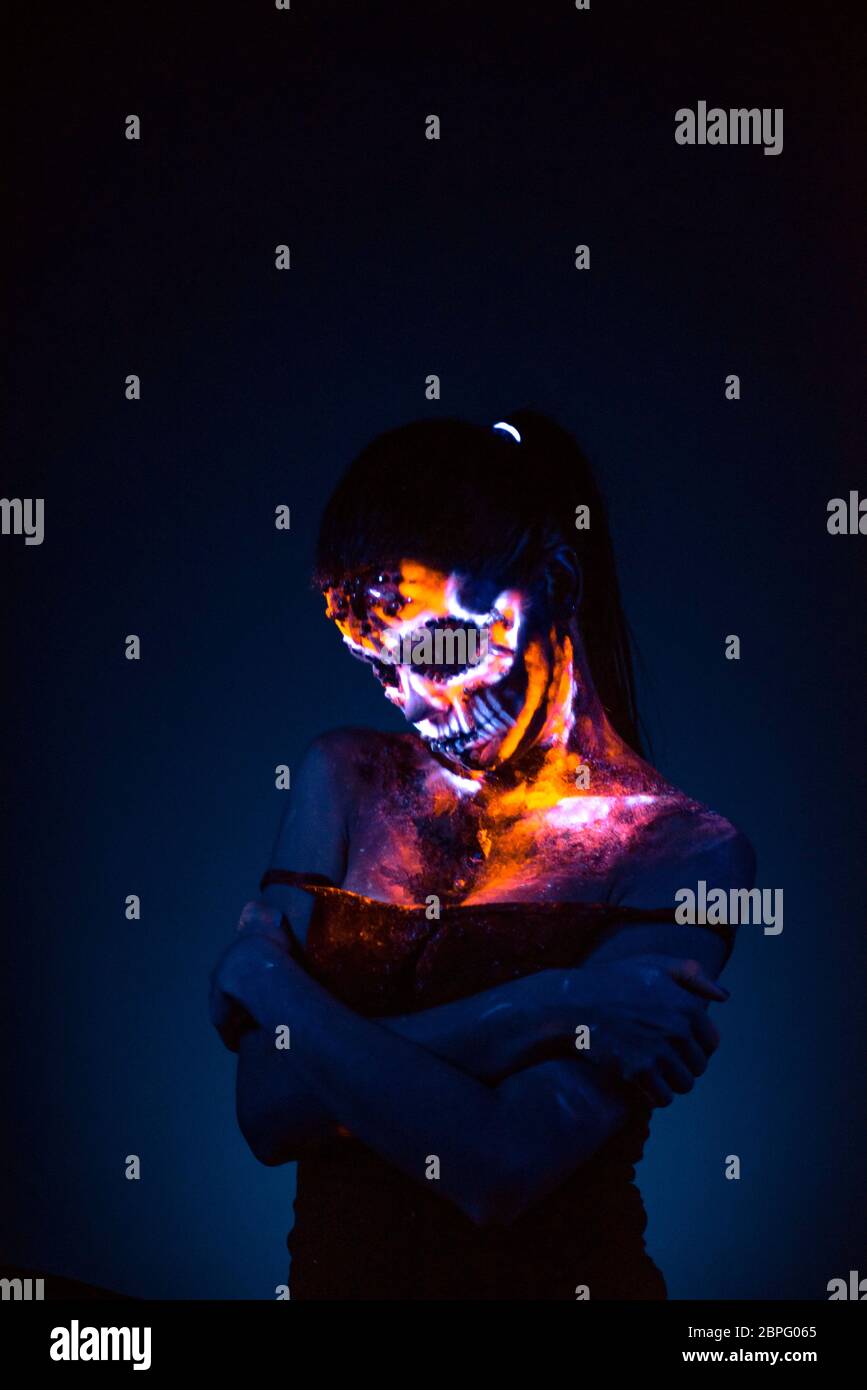 Girl's Face painted in fluorescent UV colors and looks like Neon ...