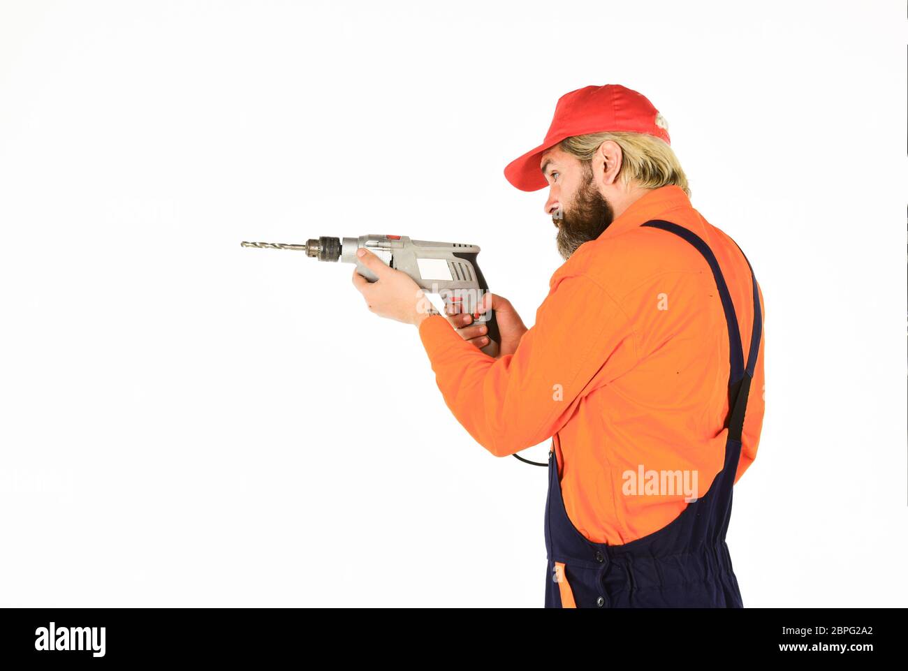 For drilling solid wall you need masonry bit. Man in cap with drills ...