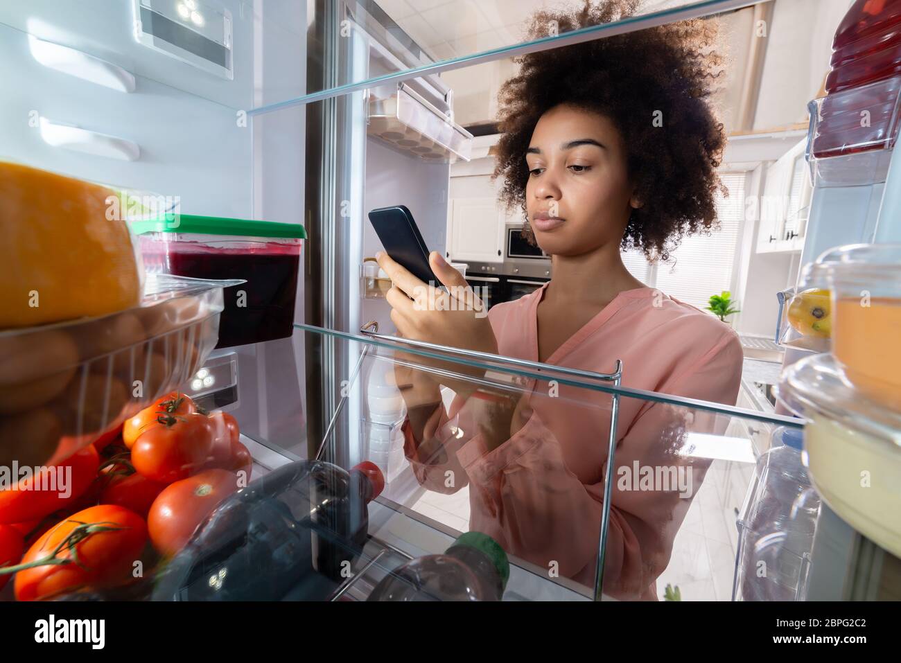 Happy Young Woman Standing In Front Of Refrigerator With Food Items ...