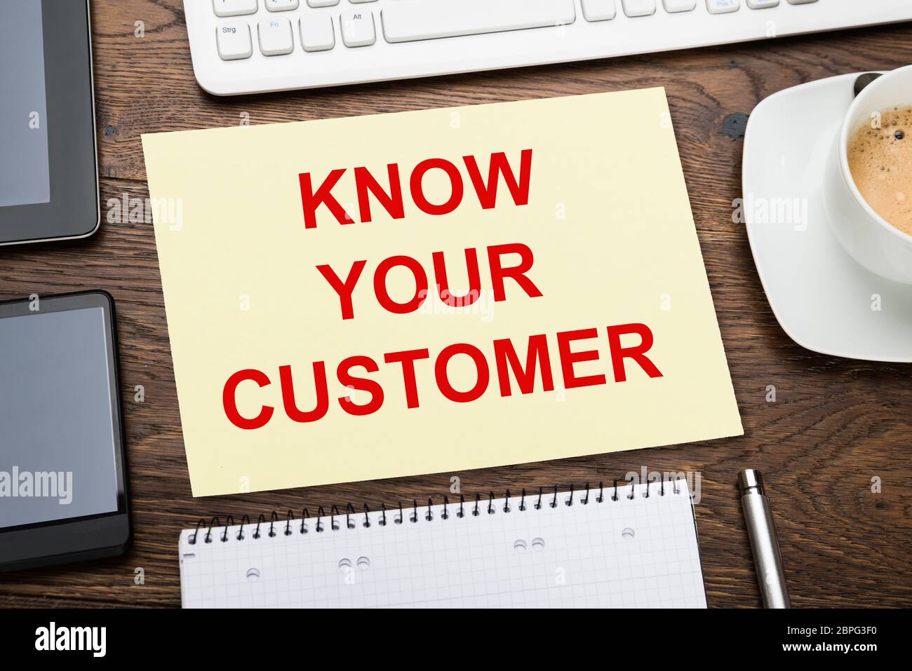 Elevated View Of Know Your Customer Text On Yellow Placard Over Wooden ...