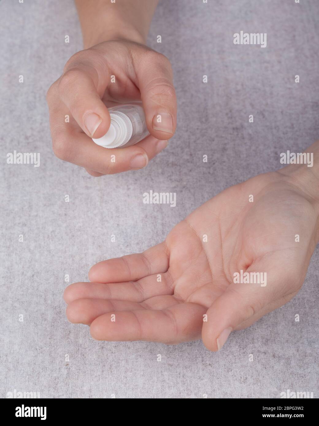 apply antiseptic spray, disinfection of hands close-up, white ...
