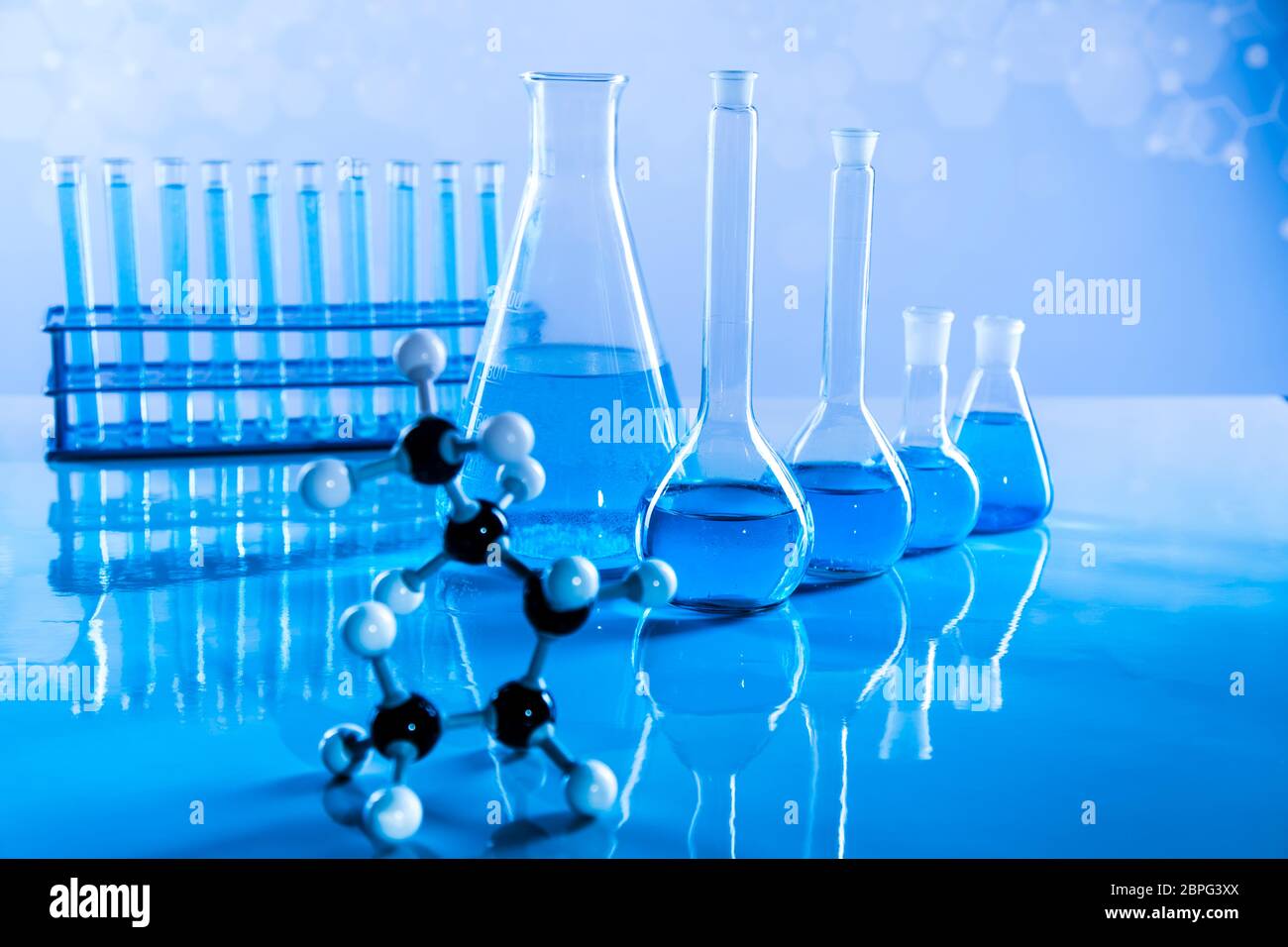 Laboratory beakers,Science experiment, blue background Stock Photo - Alamy