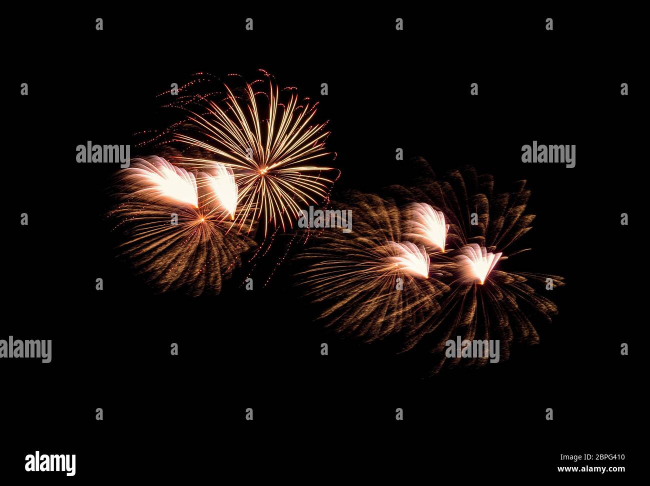 Golden exploded fireworks display, isolated on black background Stock ...
