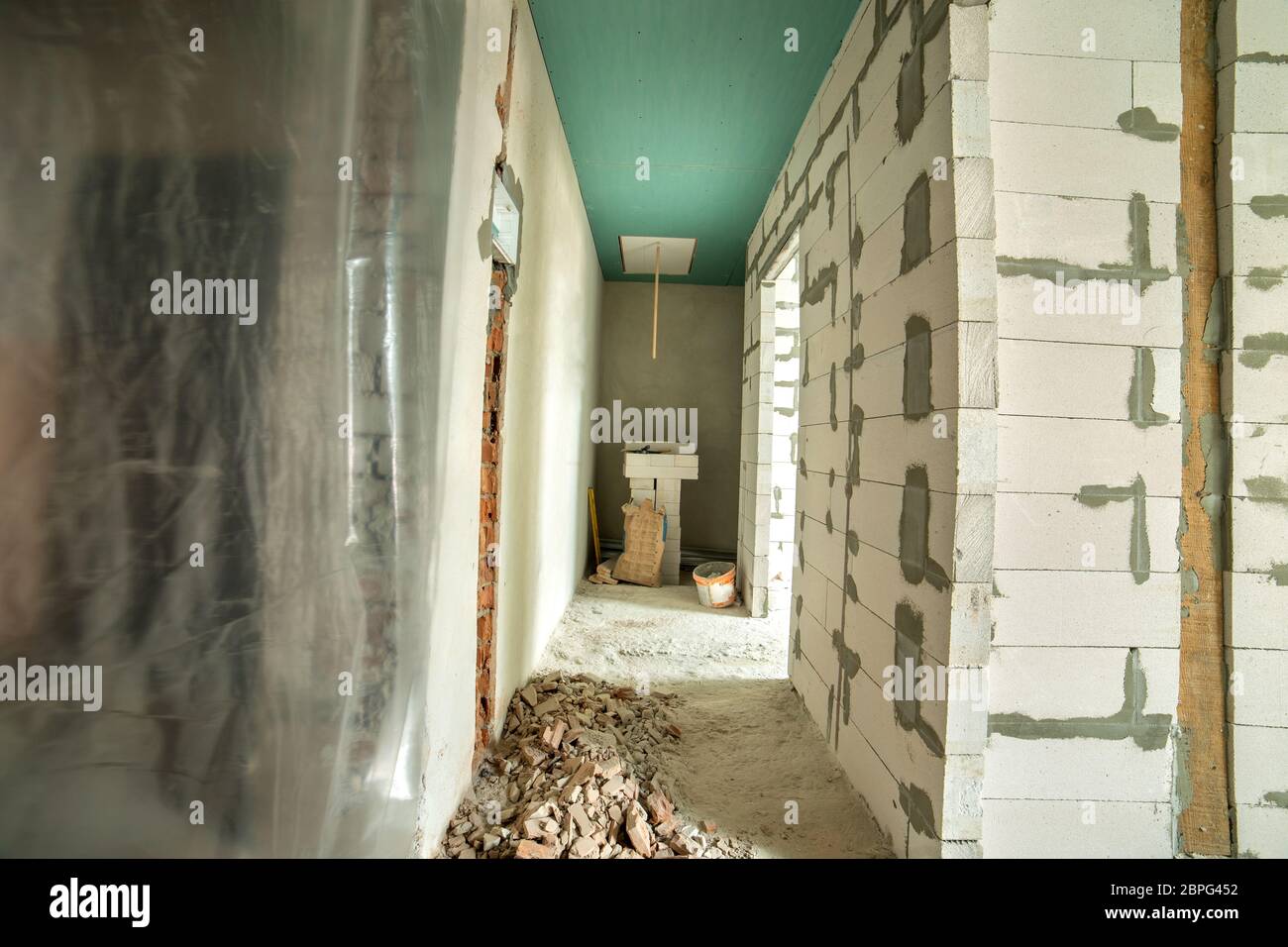 Interior of an apartment room with bare walls and ceiling under ...