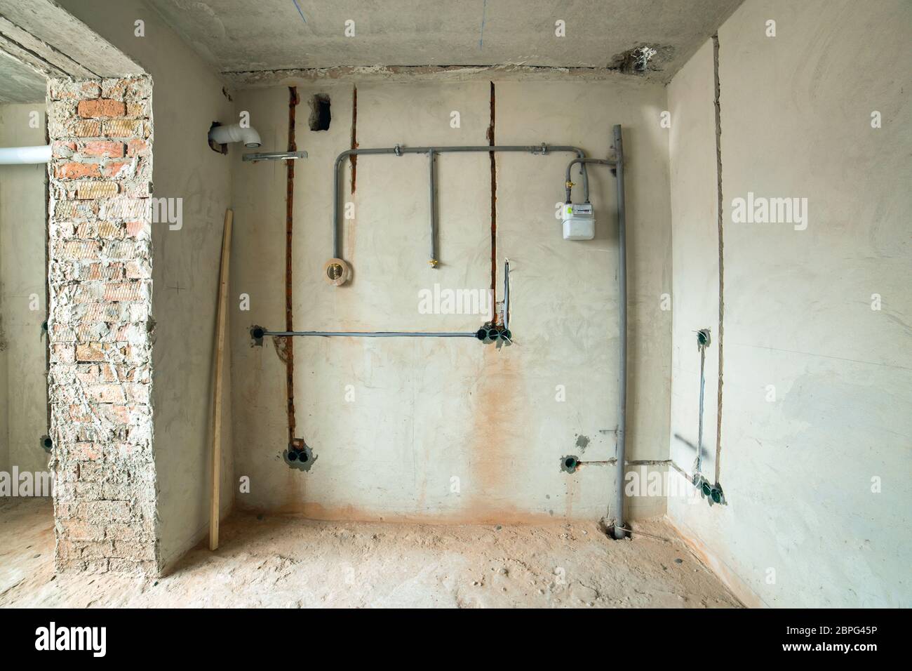 Interior of an apartment room with bare walls and ceiling under ...