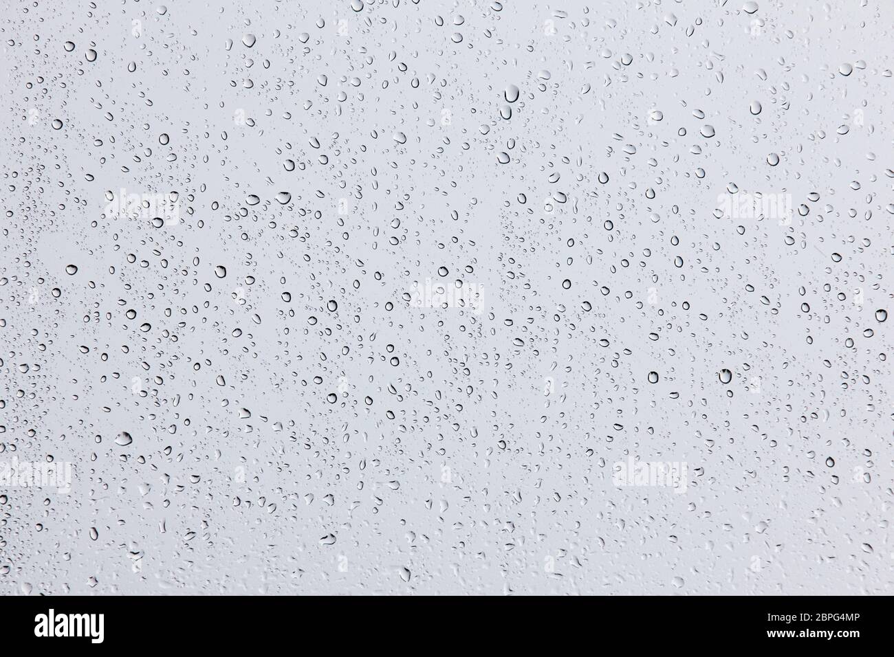 Raindrops splash on window glass hi-res stock photography and images ...