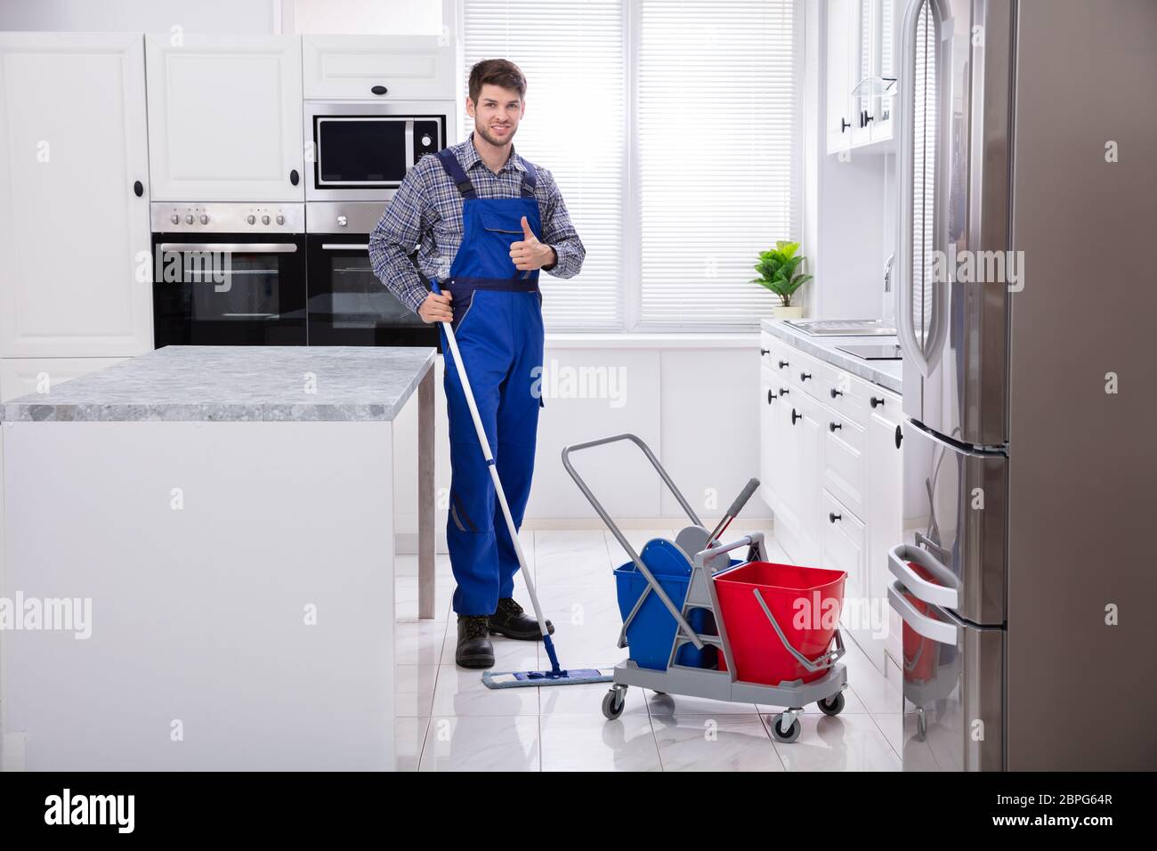 Sweeping mopping floor kitchen hi-res stock photography and images - Alamy