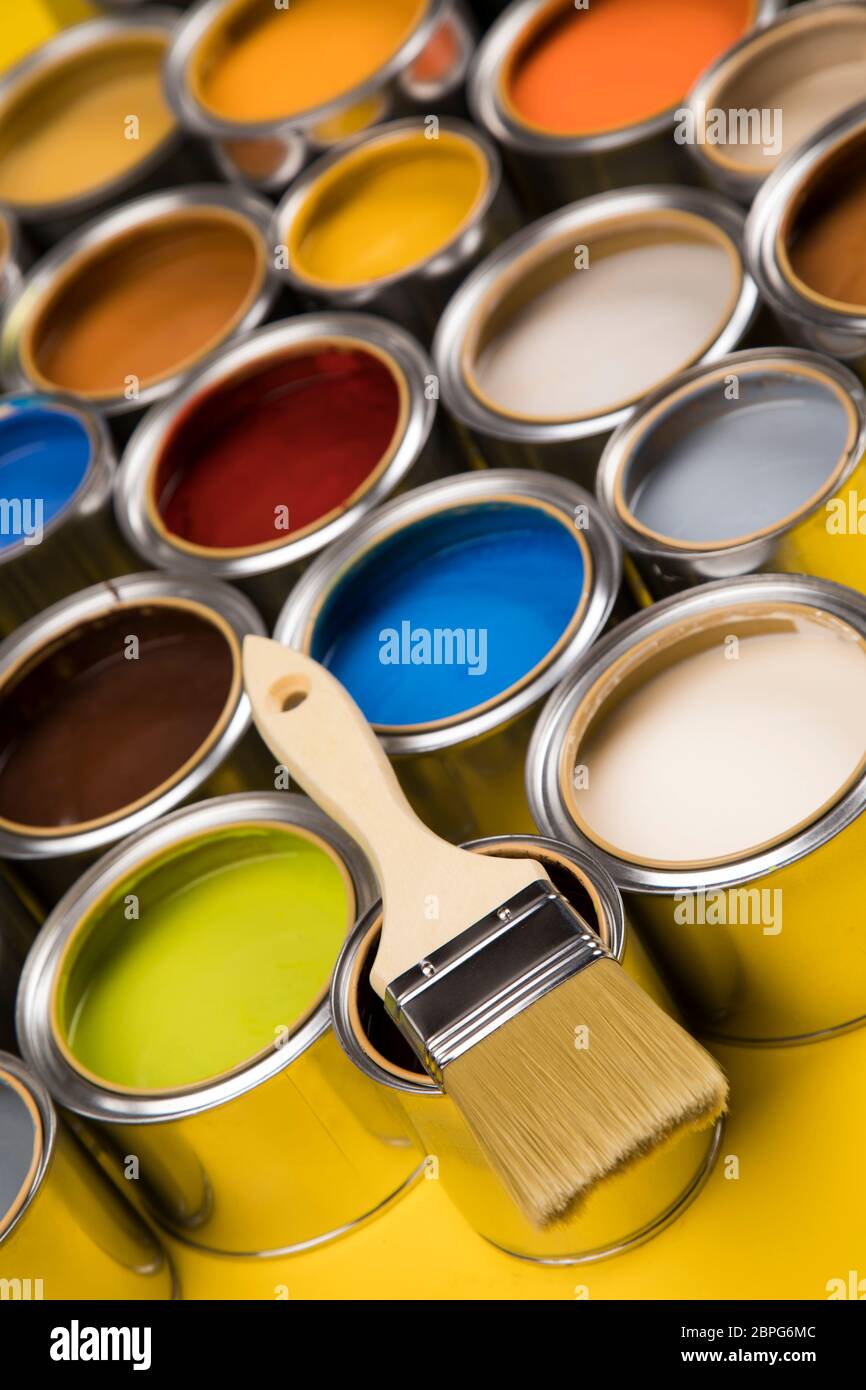 Metal tin cans with color paint and paintbrush Stock Photo - Alamy