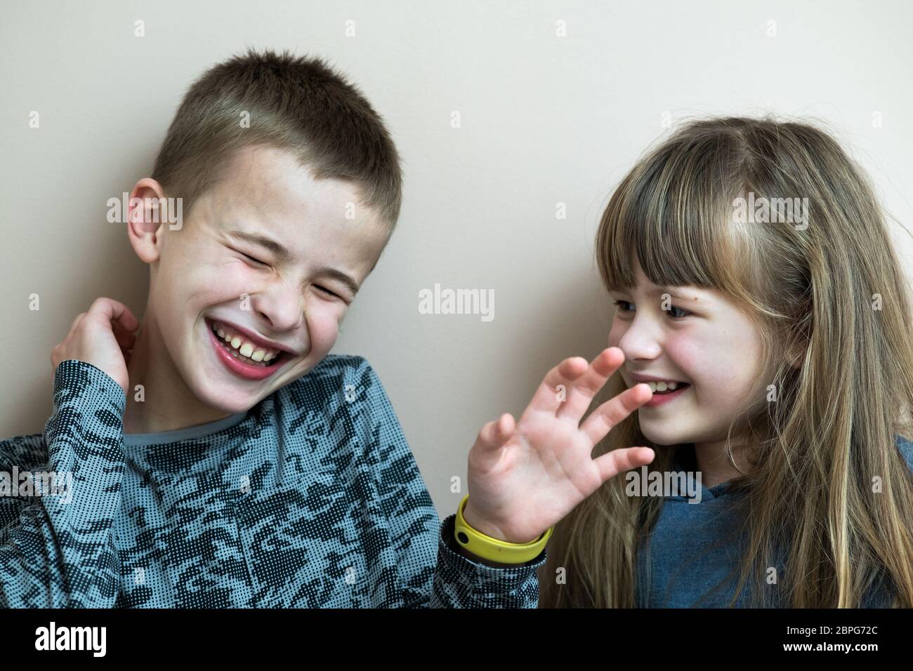 Two children boy and girl fooling around having fun together. Happy ...