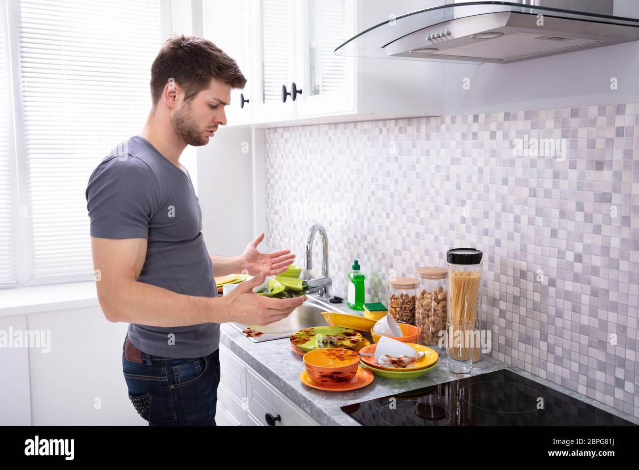 Dirty dishes sink domestic kitchen sad hi-res stock photography and ...