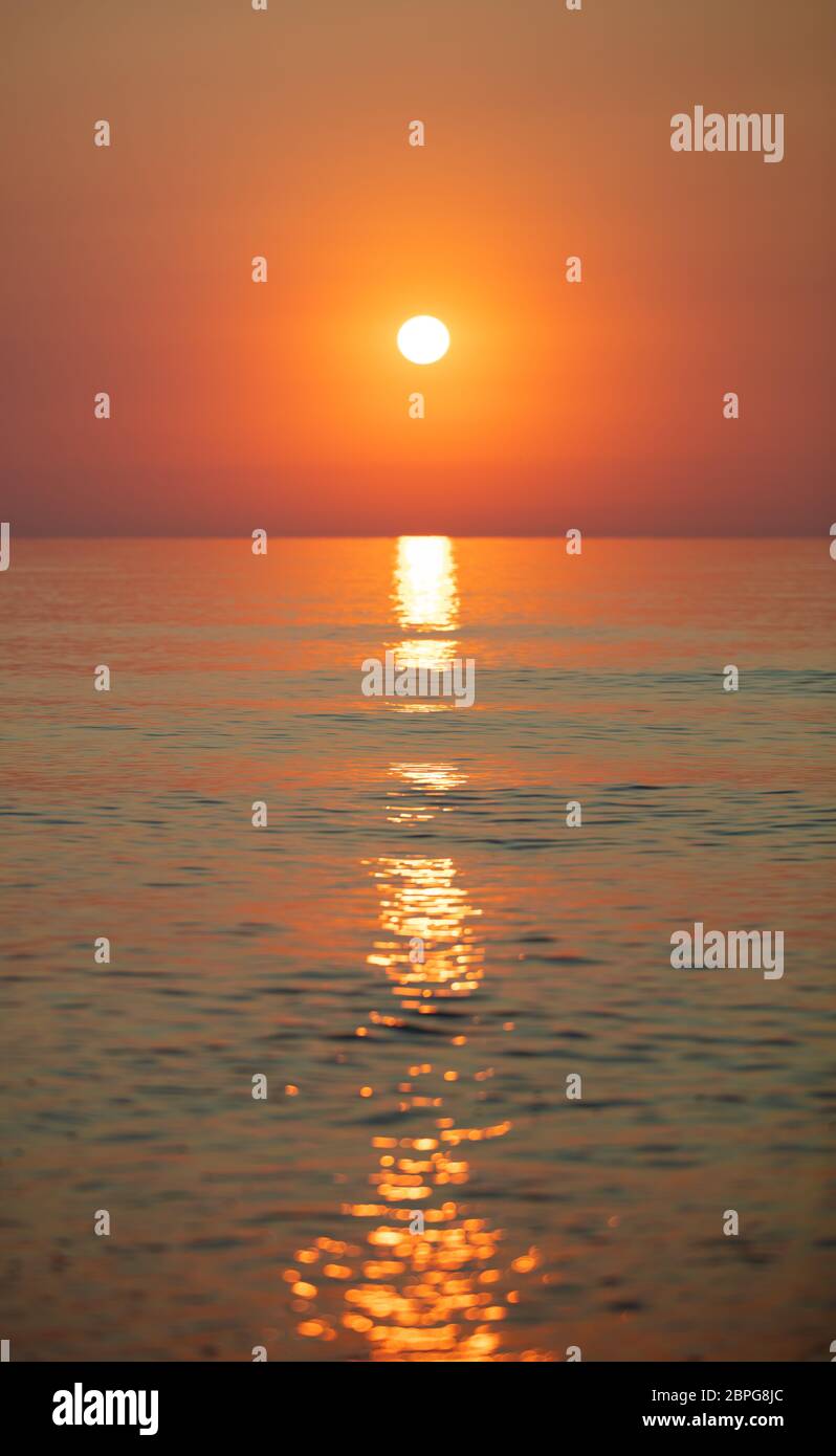 Background sunset on the sea vertically. Beautiful sunset. Ocean in the ...