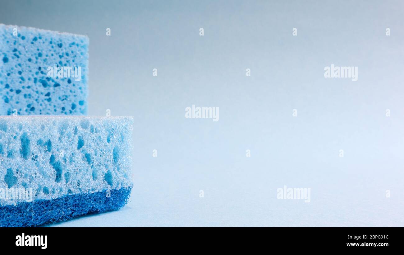 Two blue sponges used for washing and erasing dirt used by housewives ...