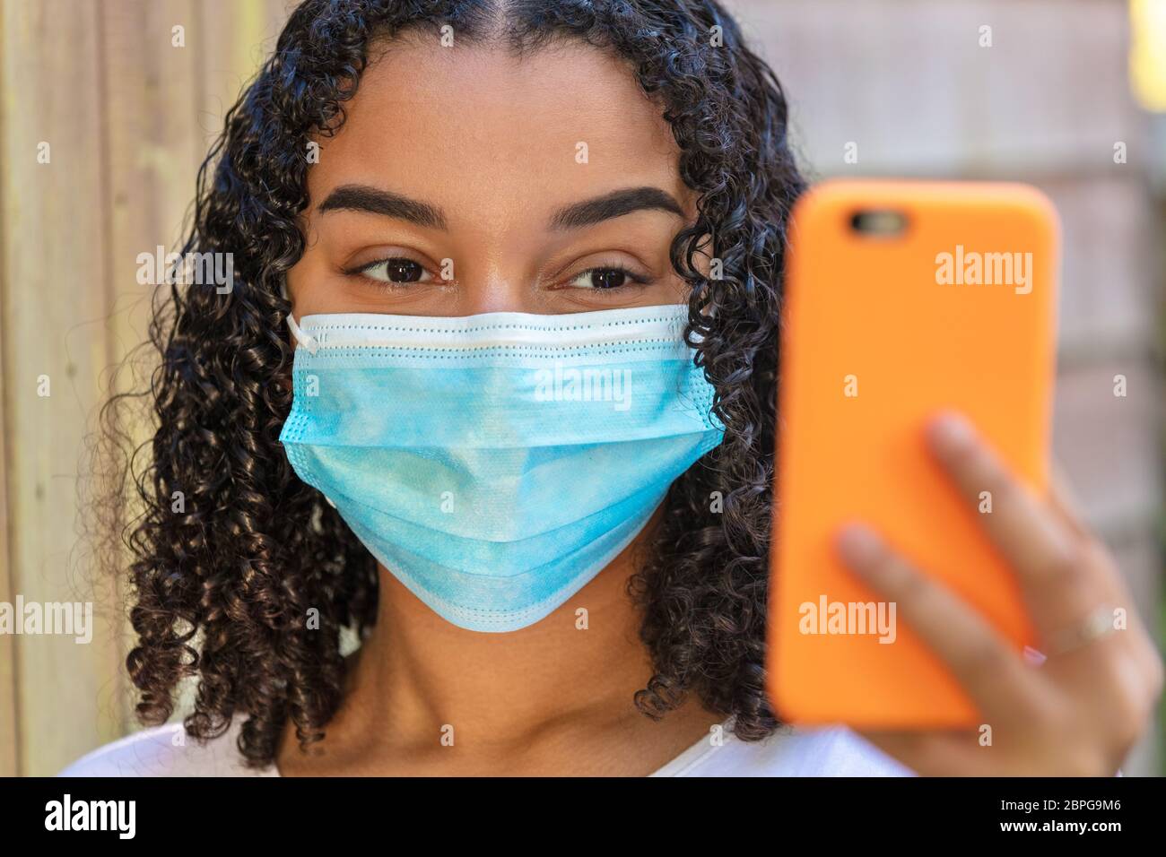 Mixed race African American teenager teen girl young woman wearing ...