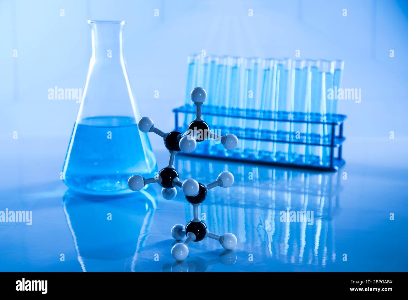 Laboratory beakers,Science experiment, blue background Stock Photo - Alamy