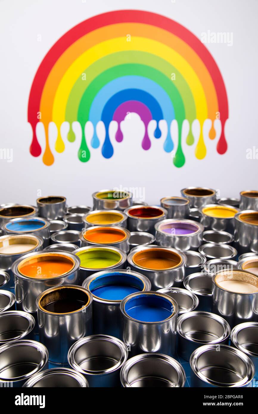 Rainbow, tin metal cans with color paint Stock Photo - Alamy
