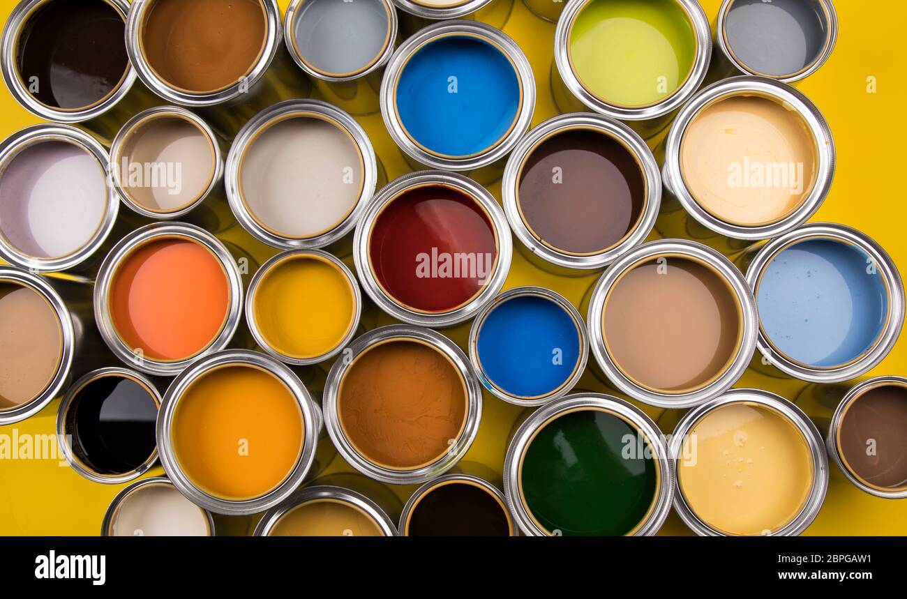 Paint cans color palette, yellow background Stock Photo - Alamy