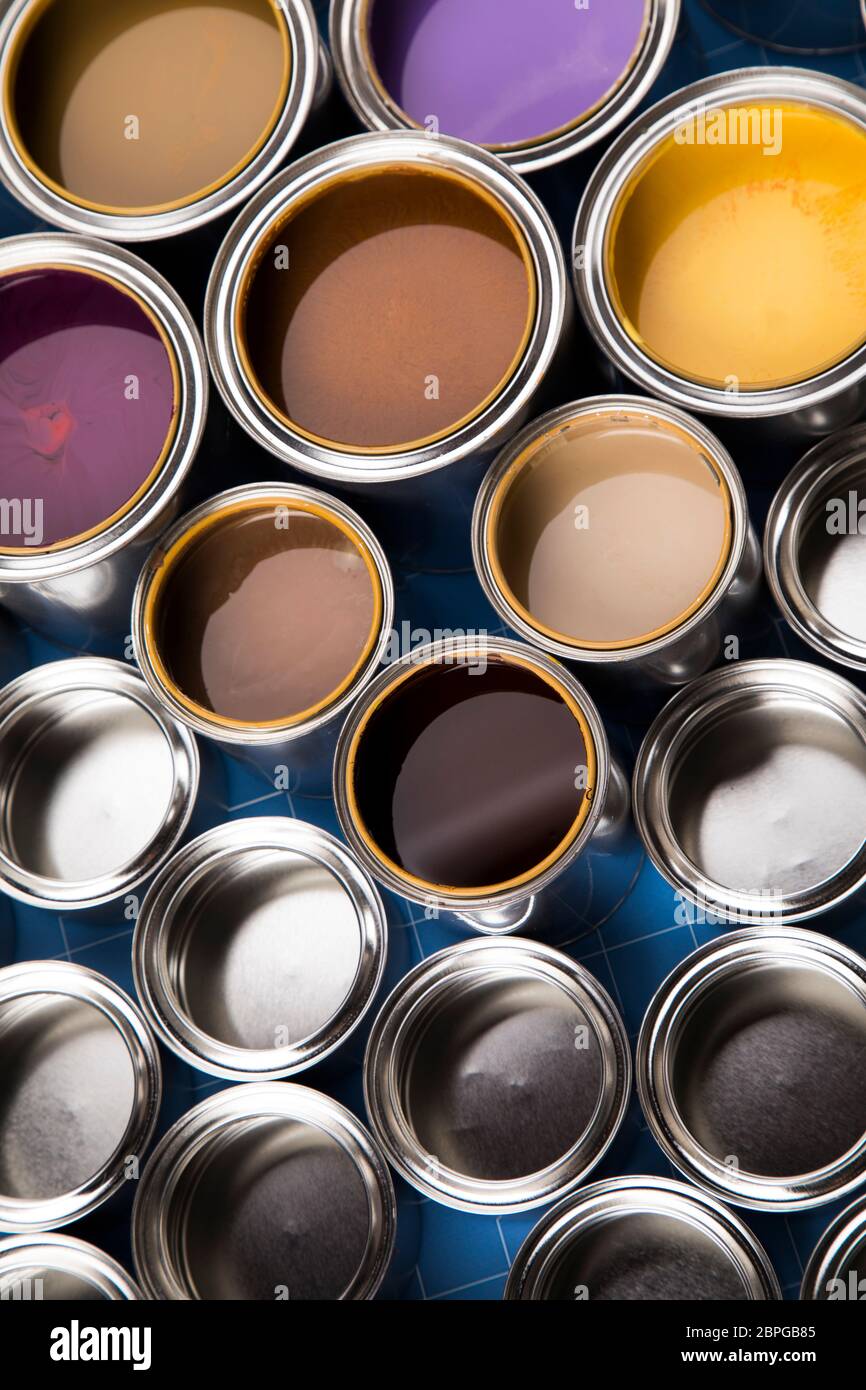 Concept group of tin metal cans with color paint Stock Photo - Alamy