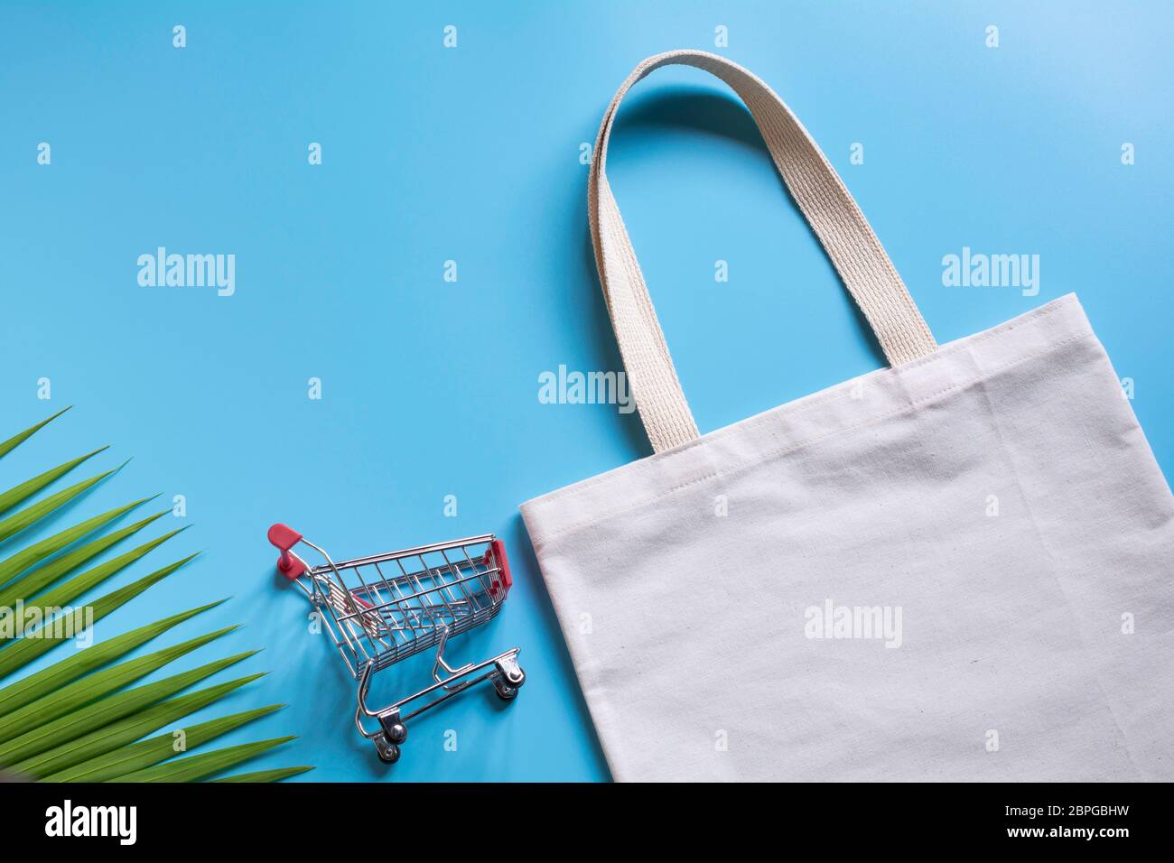 White tote bag canvas fabric and chopping cart. Cloth shopping sack ...