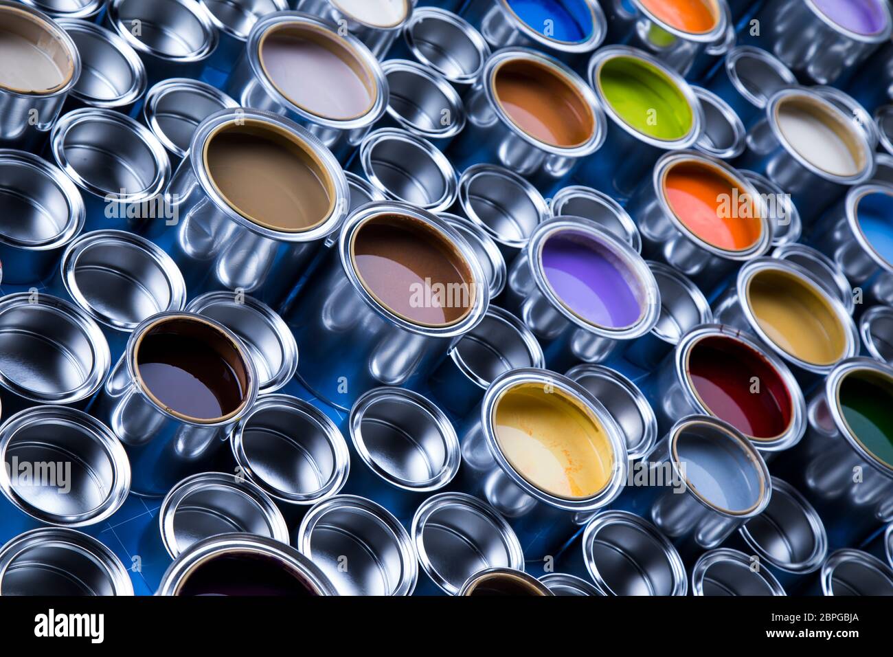 Concept group of tin metal cans with color paint Stock Photo - Alamy