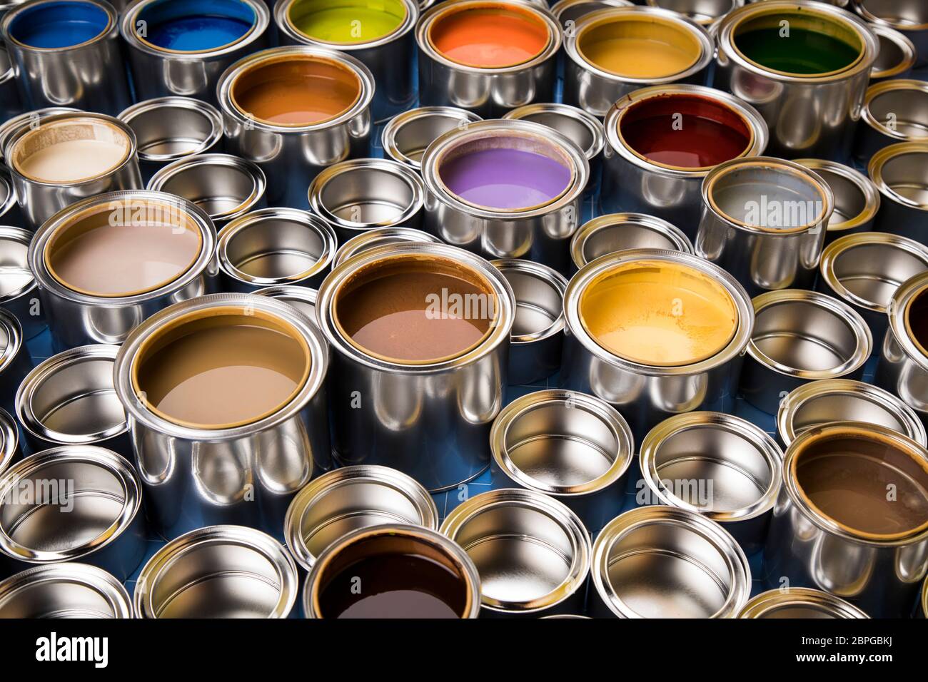 Full Buckets of rainbow colored oil paint Stock Photo - Alamy