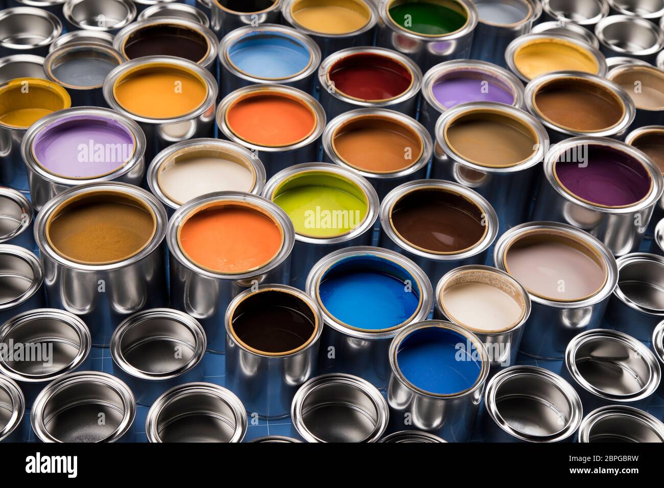 Full Buckets of rainbow colored oil paint Stock Photo - Alamy