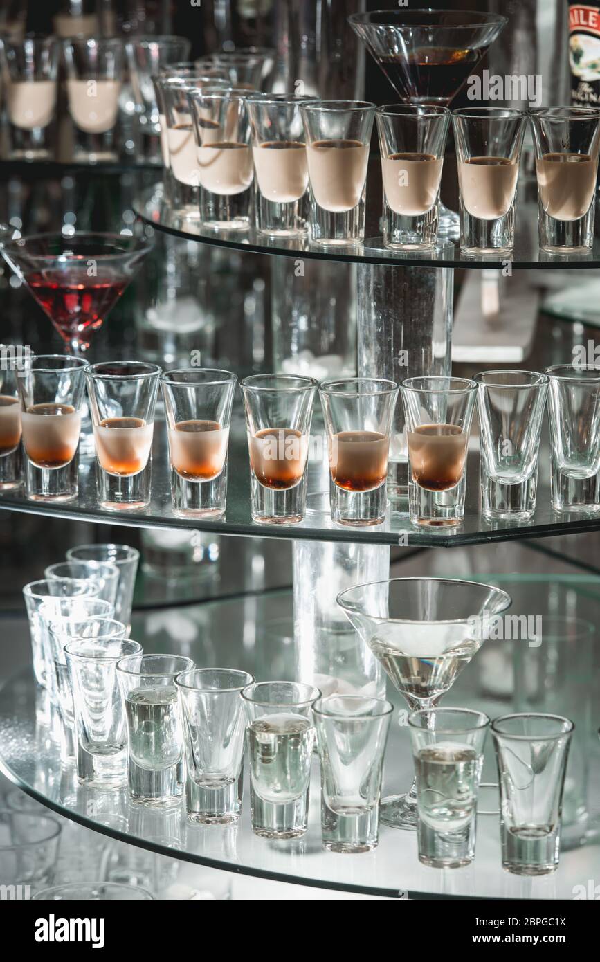 different alcohol drinks on a glass stand. wine, champagne, cognac ...