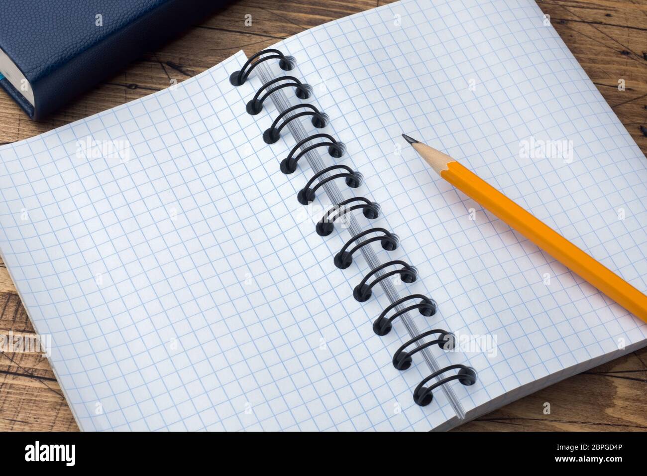 Pencil and notepad with spiral on wooden textured table Concept office ...