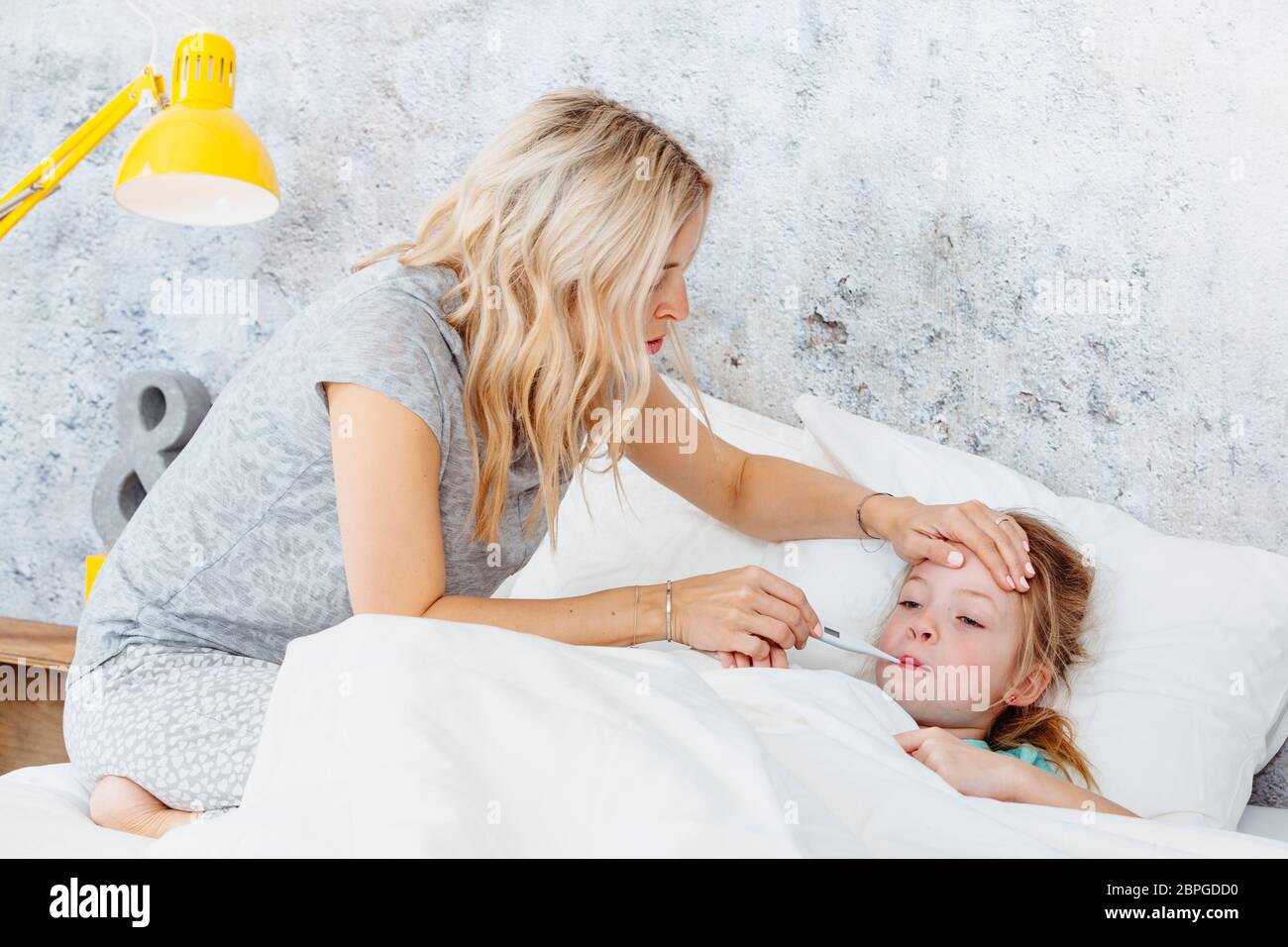 Bedroom - Sick child in bed - mother worries about her child Stock ...