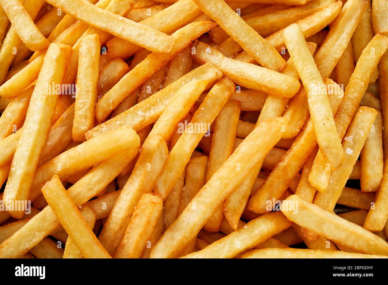 Horizontal full frame of fresh french fries potatoes viewed from above ...
