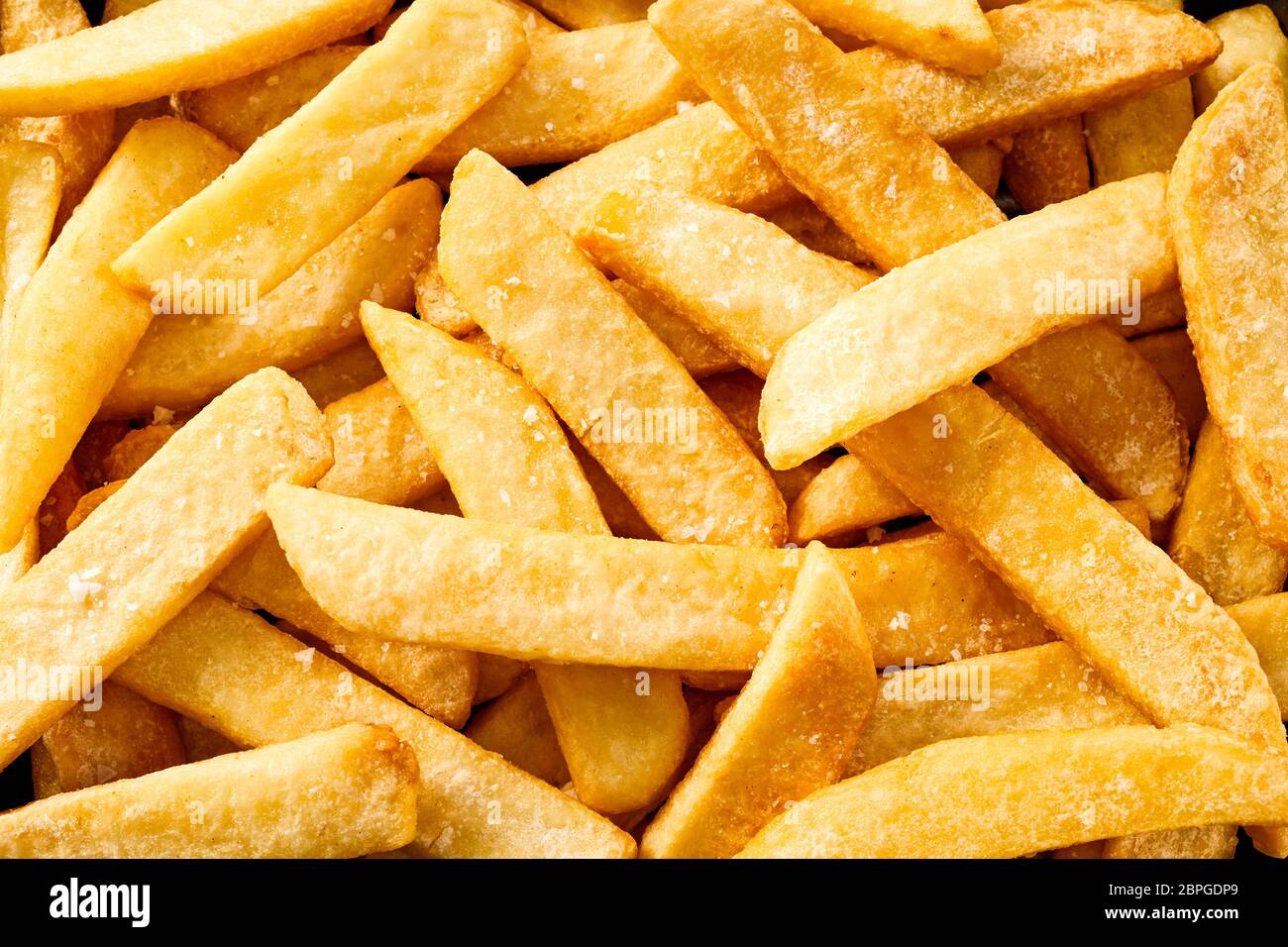 Salted homemade fried potato chips, French Fries or Pommes Frites in a ...