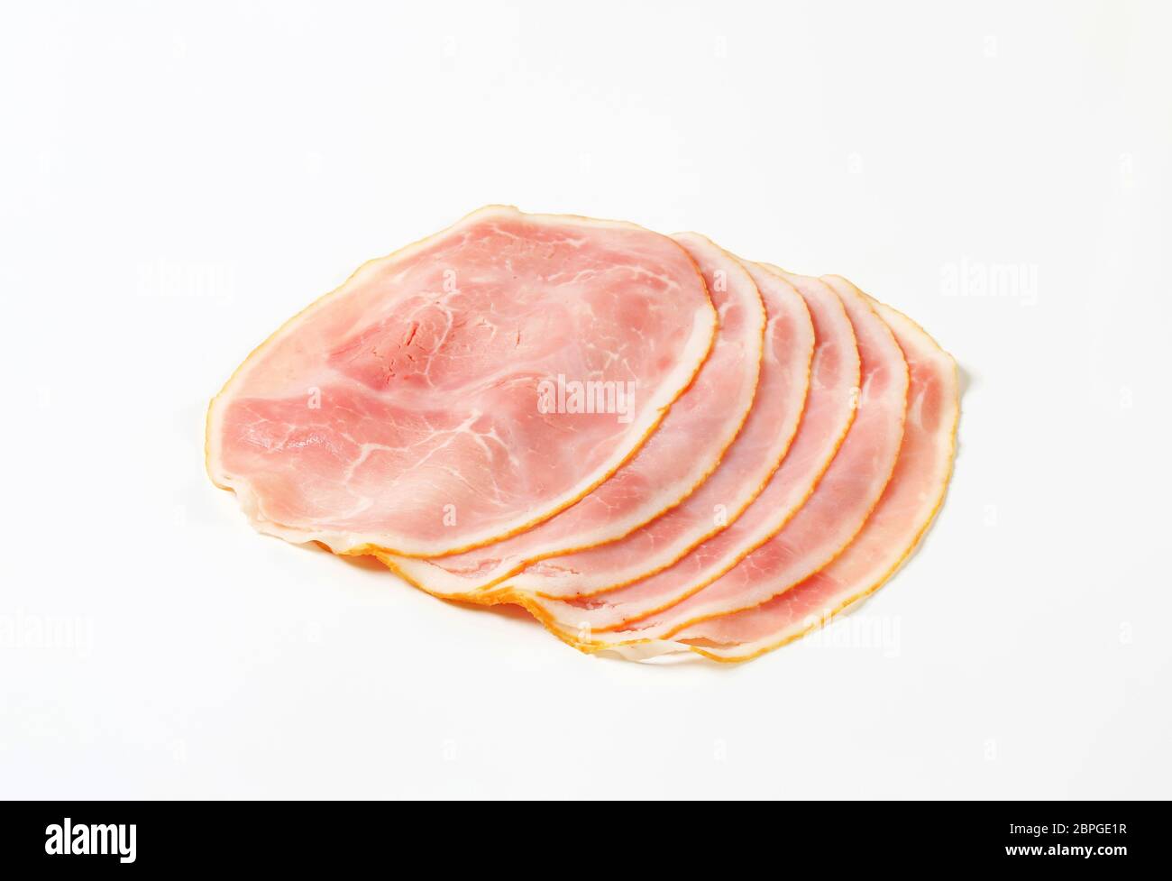 Thin slices of cooked ham on white background Stock Photo - Alamy
