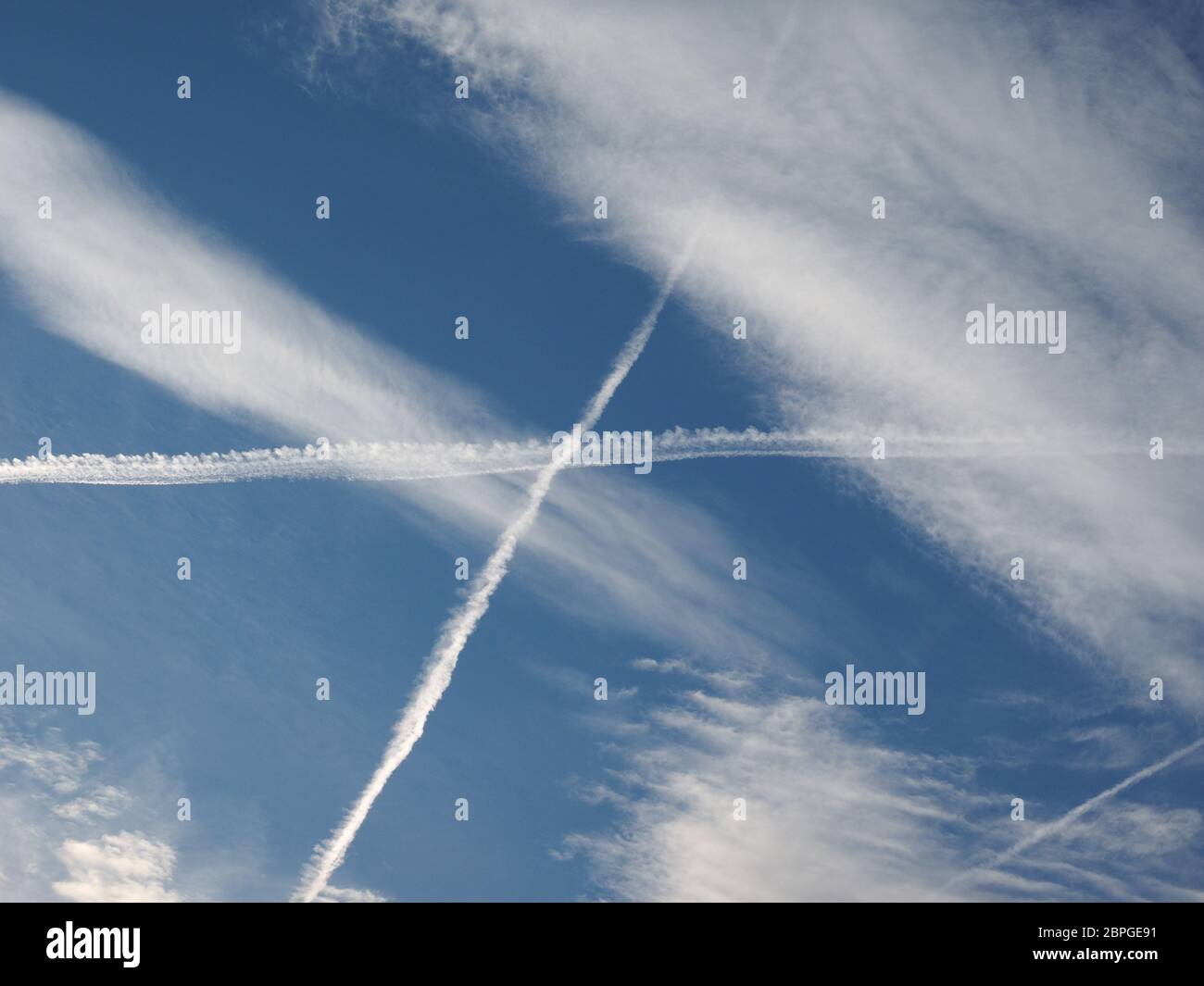blue sky with plane vapour trails (aka contrails, short for ...