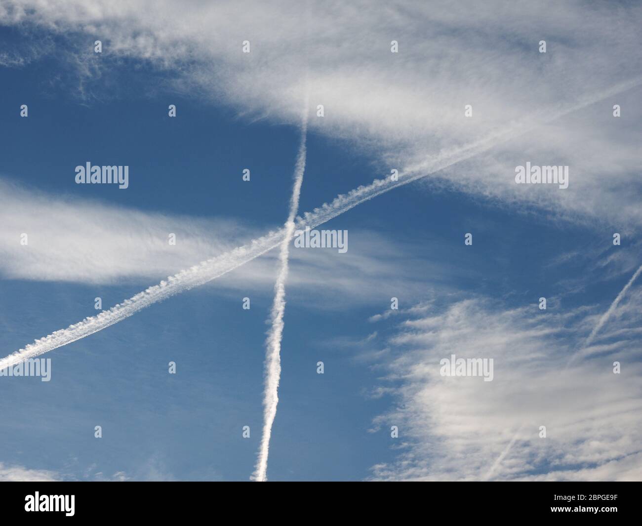 blue sky with plane vapour trails (aka contrails, short for ...