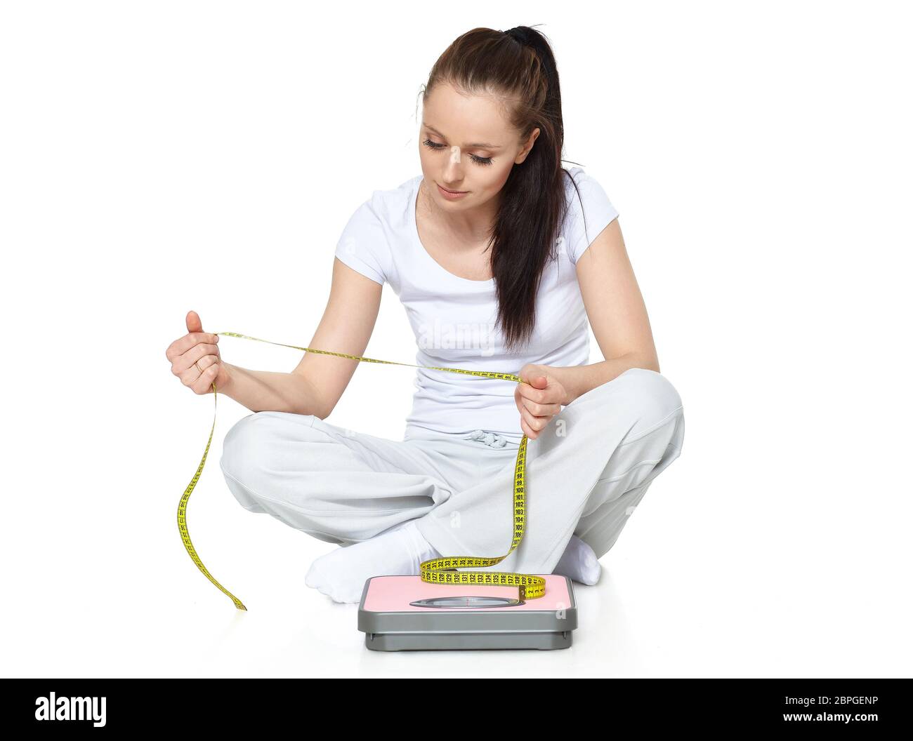 Young girl on scales Cut Out Stock Images & Pictures - Alamy