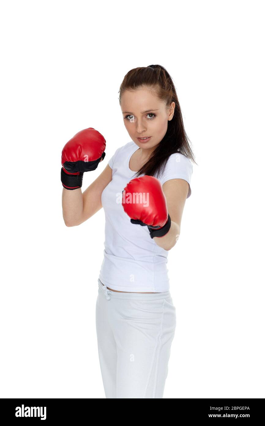 Sporty young woman in red fighting gloves on a white background Stock ...