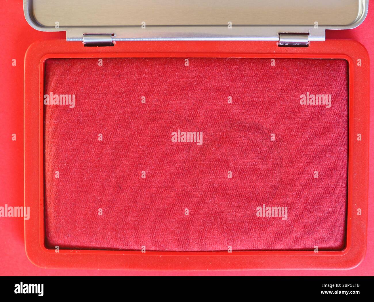 a stamp pad filled with red ink Stock Photo - Alamy