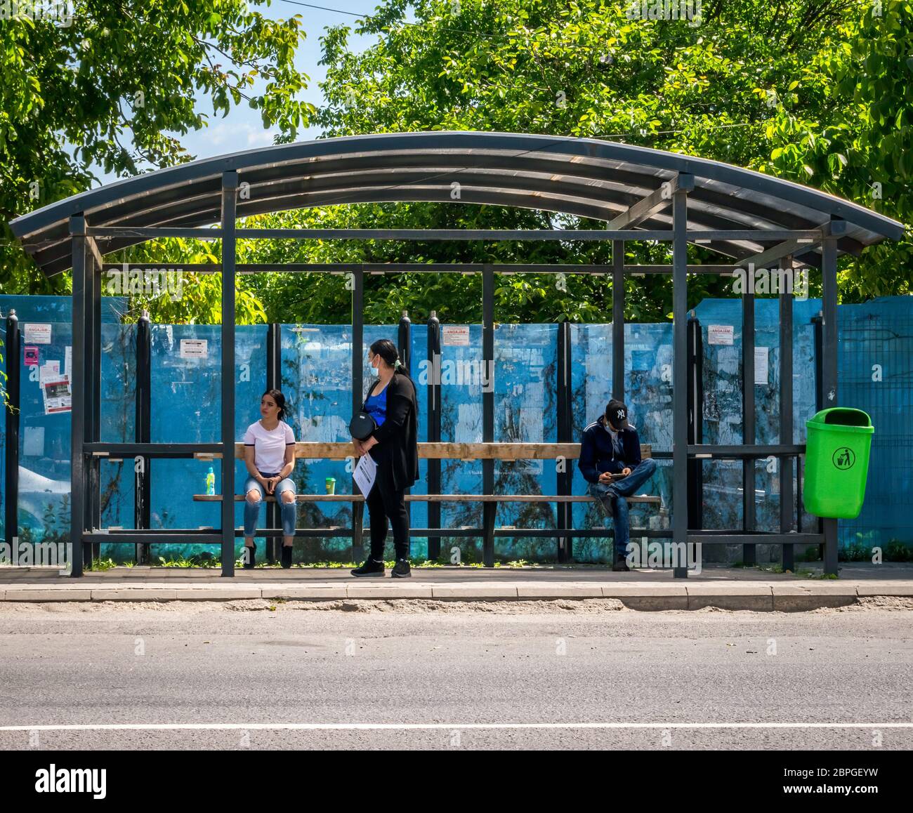 Girl mask waiting bus stop hi-res stock photography and images - Alamy