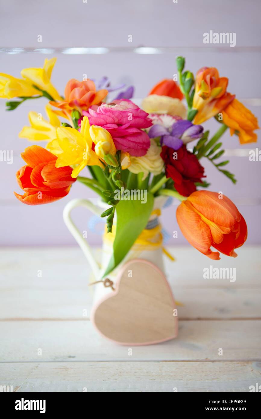 Little bouquet made from bright cheerful spring flowers Stock Photo - Alamy