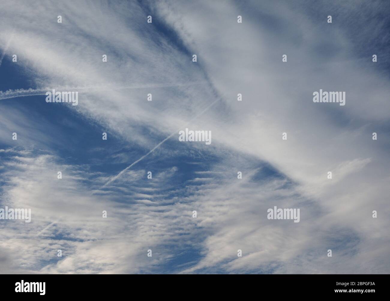 blue sky with plane vapour trails (aka contrails, short for ...