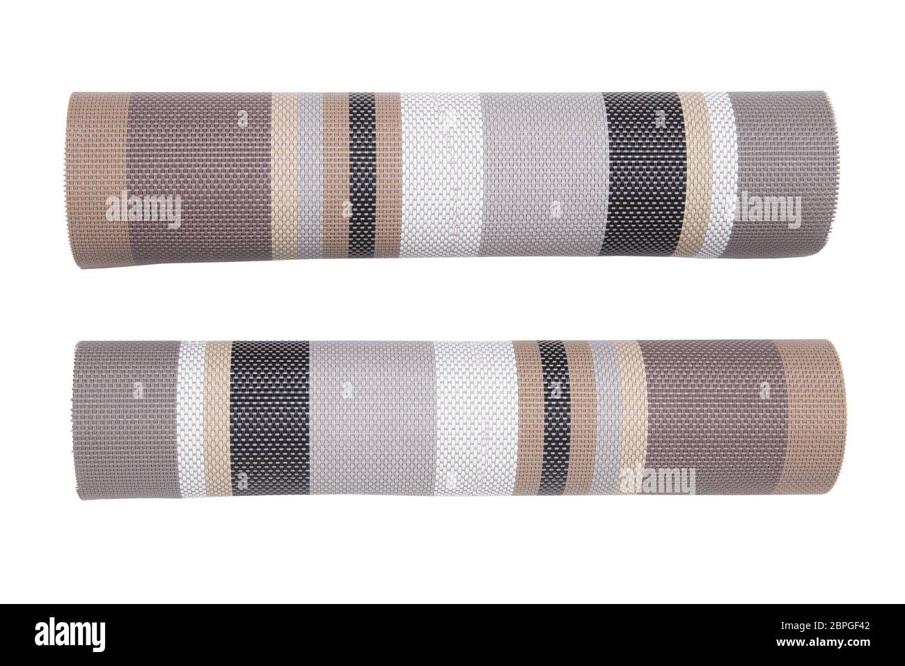 Plastic mats backgrounds. Two roles of woven plastic material with a ...