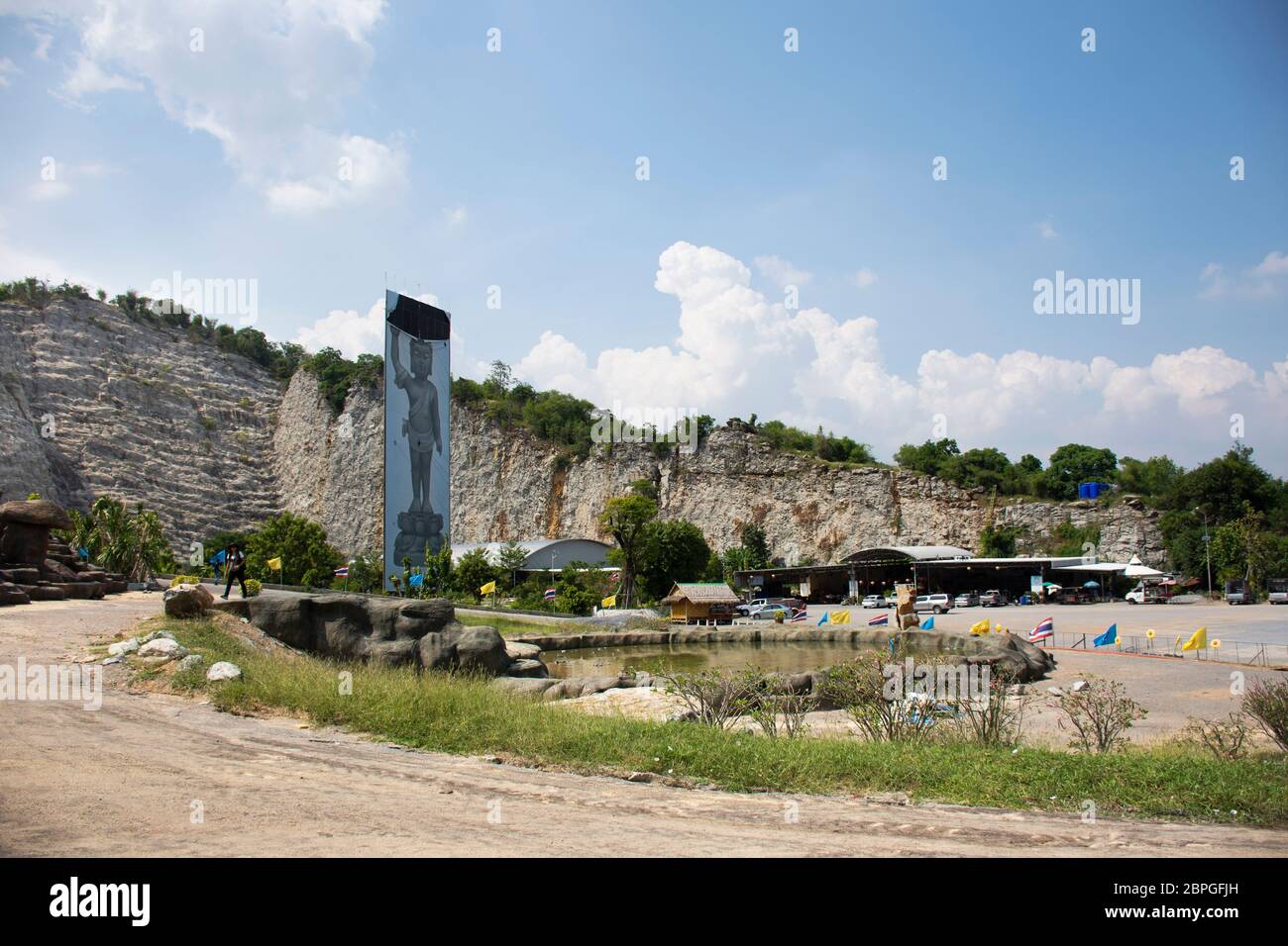 SUPHAN BURI, THAILAND - OCTOBER 28 : Big buddha carving on stone cliff ...