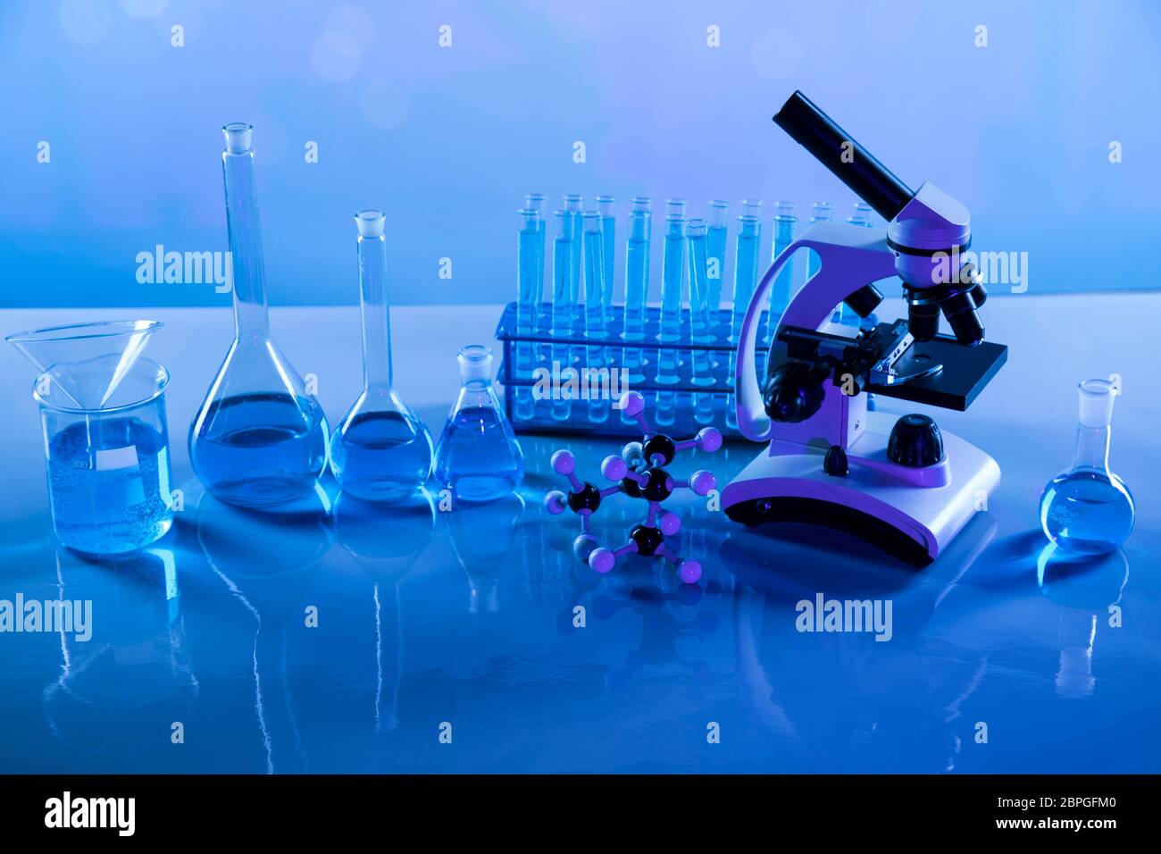 Laboratory beakers,Science experiment, blue background Stock Photo - Alamy