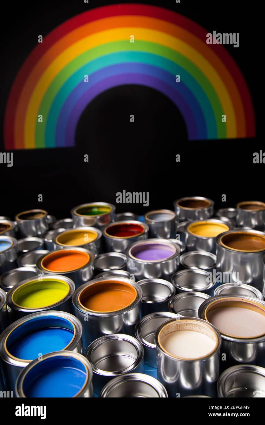 Rainbow, tin metal cans with color paint Stock Photo - Alamy